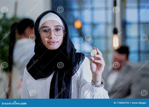 Young Arabian Muslim Woman In Hijab Black Clothes Hold In Hand Holding