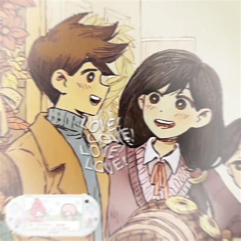 Two People Standing Next To Each Other In Front Of A Wall With Cartoon