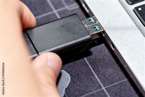 Hand Inserting Hardware Wallet Plugged Into A Computer Laptop Hand Inserting Usb Flash Memory