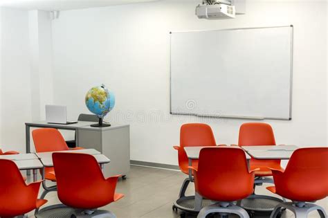 Modern Classroom Interior With White Board Work Desks And Chairs