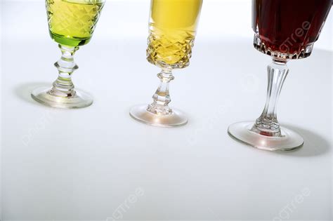 Three Cut Glass Wine Glasses Captured From A Low Angle Photo Background