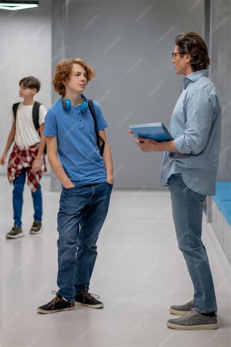 Premium Photo Full Length Portrait Of A Schoolboy Talking To A