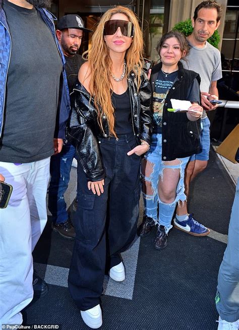 Shakira Looks Chic In A Shiny Black Jacket And Oversized Sunglasses