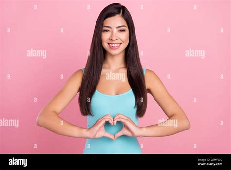 Photo Of Flirty Millennial Brown Hairdo Lady Show Heart Wear Blue Top