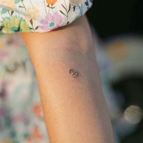 Tiny Minimalistic Cherry Tattoo Done On The Inner