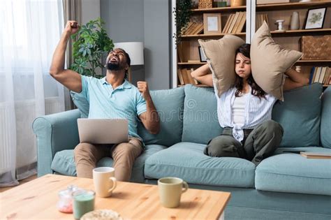 Young Couple Stares At The Ceiling And Yells Because A Neighbor