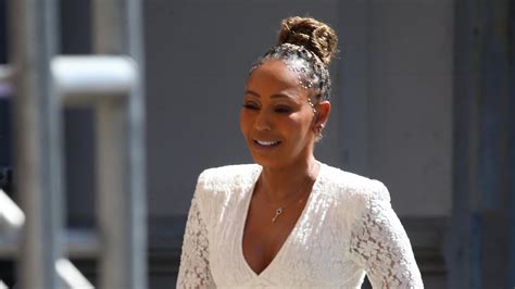 Mel B Puts On A Leggy Display In A Plunging White Lace Mini Dress As