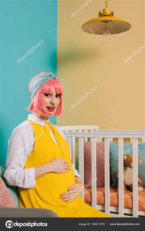 Happy Pregnant Pin Woman Pink Hair Touching Belly Looking Camera
