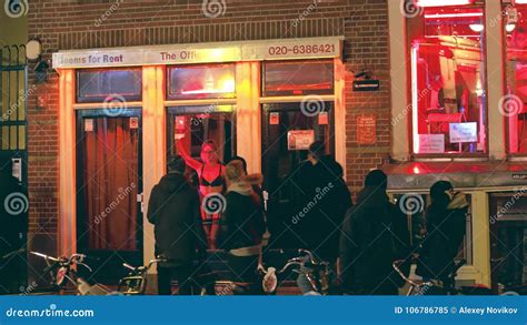 AMSTERDAM NETHERLANDS DECEMBER 27 2017 Tourists Walk By