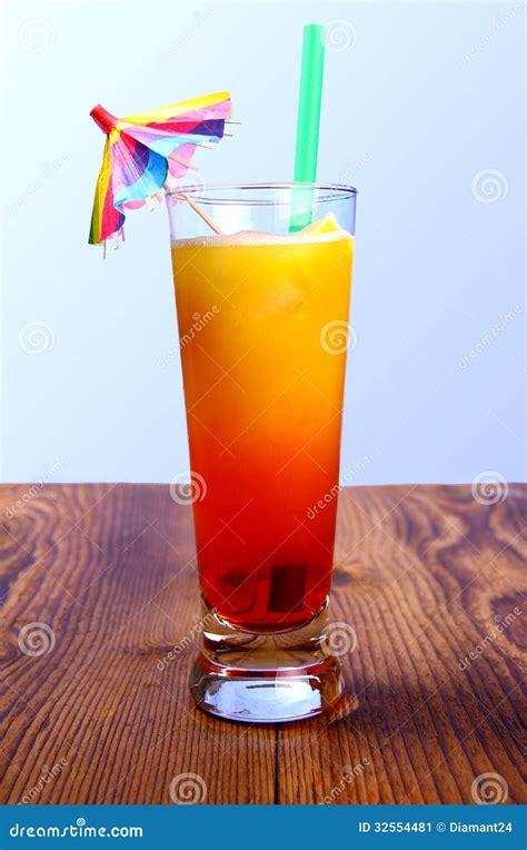 Red Yellow Cocktail And Lemon Straw With Umbrella Deco Stock Image