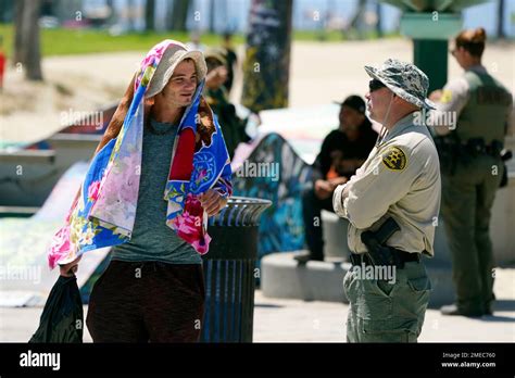 A Member Of The Los Angeles County Sheriffs Departments Host Homeless