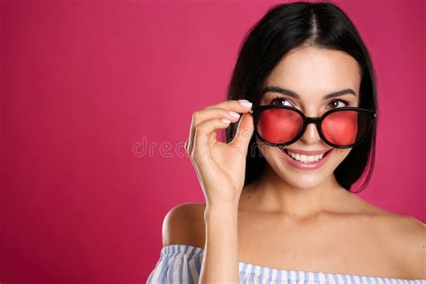 Beautiful Woman Wearing Sunglasses On Pink Background Closeup Space
