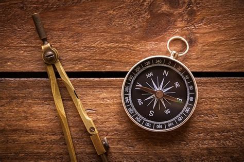 Premium Photo Vintage Drawing And Navigational Compass On A Rustic