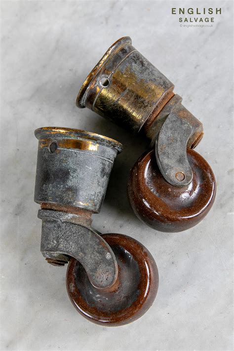 Pair Of Large Brass And Ceramic Castors