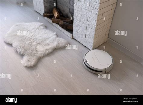 Robotic Vacuum Cleaner On Laminate Wood Floor Smart Cleaning Technology