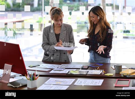 Two Creative Women Are Planning Application And Developing Template