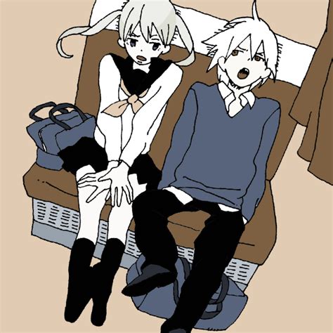 Two Anime Characters Sitting On A Couch