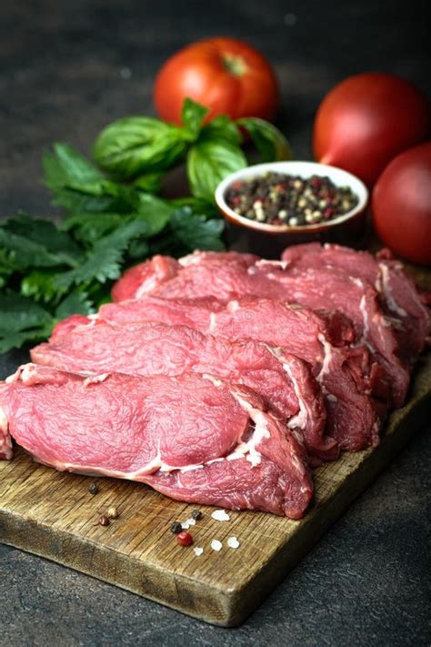 Fresh Raw Beef Cut Into Steaks On A Wooden Board Stock Image Image Of Herbs Dinner 164655823