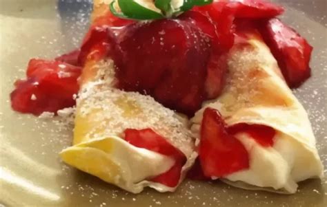 Delightful Crepes With Sweet Cream And Strawberries