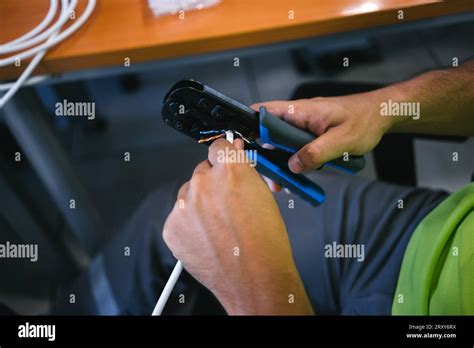 Unrecognizable Hand Cutting Ethernet Network Cable With Tool For