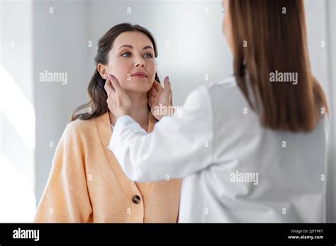 Doctor Checking Lymph Nodes Of Woman At Hospital Stock Photo Alamy