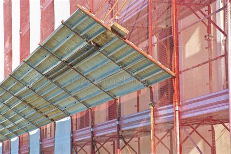 Metal Scaffolding With Protective Dust Sheets For The Restoration And