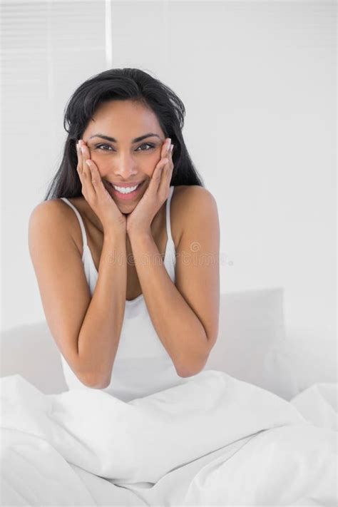 Gleeful Dark Haired Woman Posing Smiling At Camera Stock Image Image Of Cushion Hair