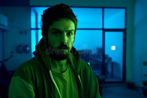 Man Portrait And Criminal In Dark Neon Garage With Cybersecurity