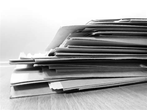 Premium Photo Close Up Of Stacked Files On Table