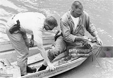 Fbi Agents Lower Dragging Hooks Into The Pearl River Near Here June