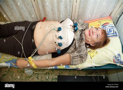 Female Patient During Ecg Procedure In Clinic Stock Photo Alamy