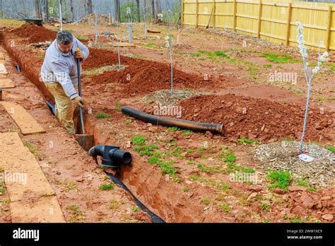 Installing An Underground Drainage System For Outflow Of Rain
