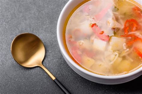 Premium Photo Closeup Of A Bowl Of Chicken Noodle And Vegetable Soup