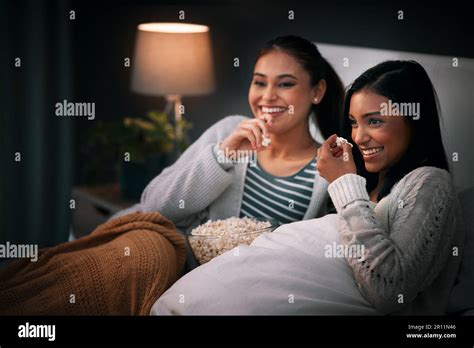 Laughing Popcorn And Women Watching Tv Movies Or Show At Home For