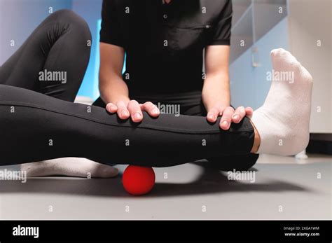 Myofascial Release A Male Physiotherapist Puts A Ball To Rehabilitate