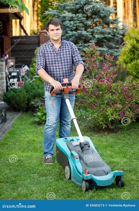 Young Man Mowing Grass At House Backyard Stock Image Image Of Mowing