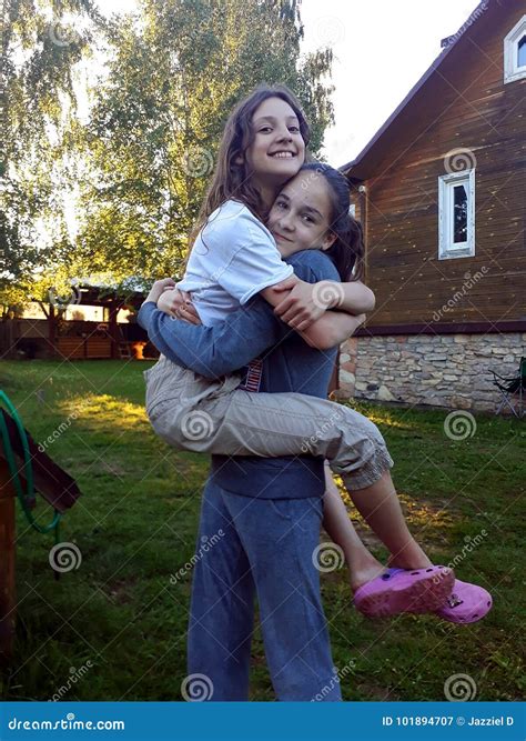 Two Teen Girls Playing And Embracing Each Other Stock Image Image Of