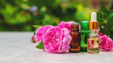 Premium Photo Rose Essential Oil In A Bottle Selective Focus
