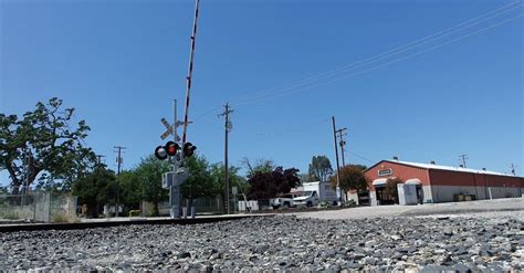 A Train Passing Through A Railroad Crossing · Free Stock Video