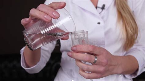 The Nurse Pours The Medicine Into The Container For The Oxygen Inhaler