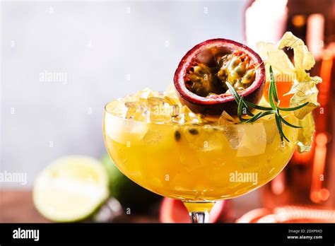 Passion Fruit Alcoholic Cocktail With Gin Juice Rosemary And Ice