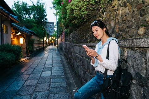 Premium Photo Elegant Lady Relying On The Stone Wall And Relaxing