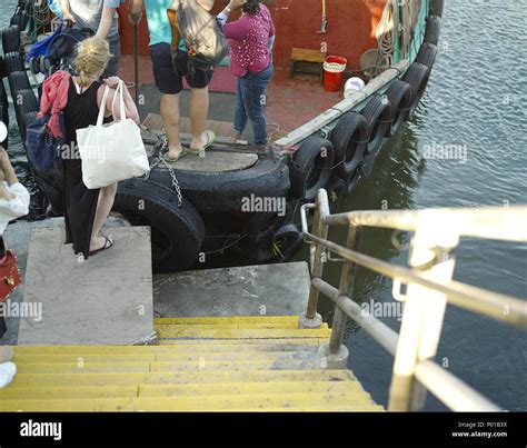 Passengers Boarding On A Motorboat Blurred Motion Outdoor Shot Stock