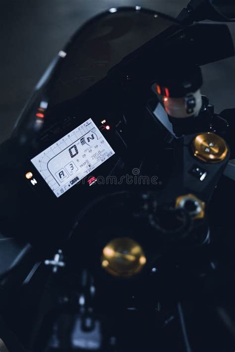 Closeup Of Motorcycle Dashboard With Illuminated Display Screen Showing