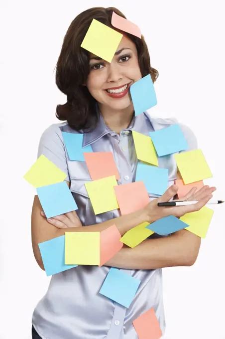Woman Covered In Sticky Notes Superstock