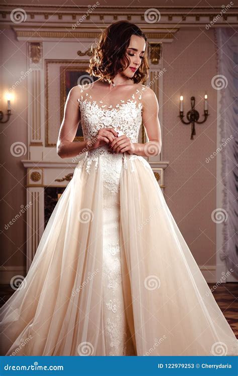 Sensual Brunette Bride In Luxury Wedding Dress Over Classic Interior