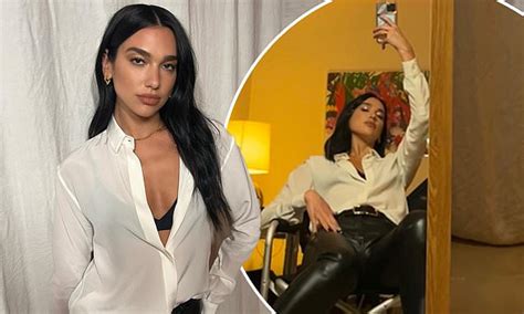 Dua Lipa Flashes Her Bra In A Sheer White Shirt In Behind The Scenes