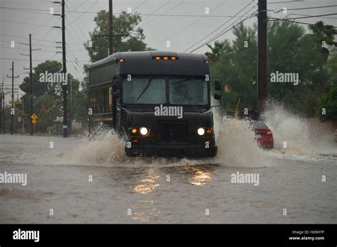 An United Parcel Service Delivery Truck Drives Through Flooded Streets