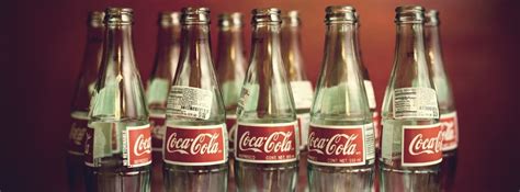 Coke Bottles In Dark Magenta And Warm Red Glow Facebook Cover Photo