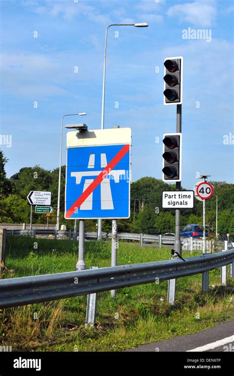 A British Road Sign Indicating The End Of The Motorway Next To Stock Photo Alamy